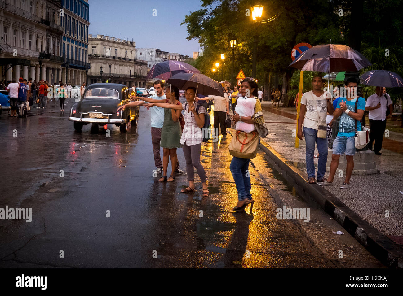 Havana, Cuba: Waiting for a taxi, rainy evening Stock Photo - Alamy