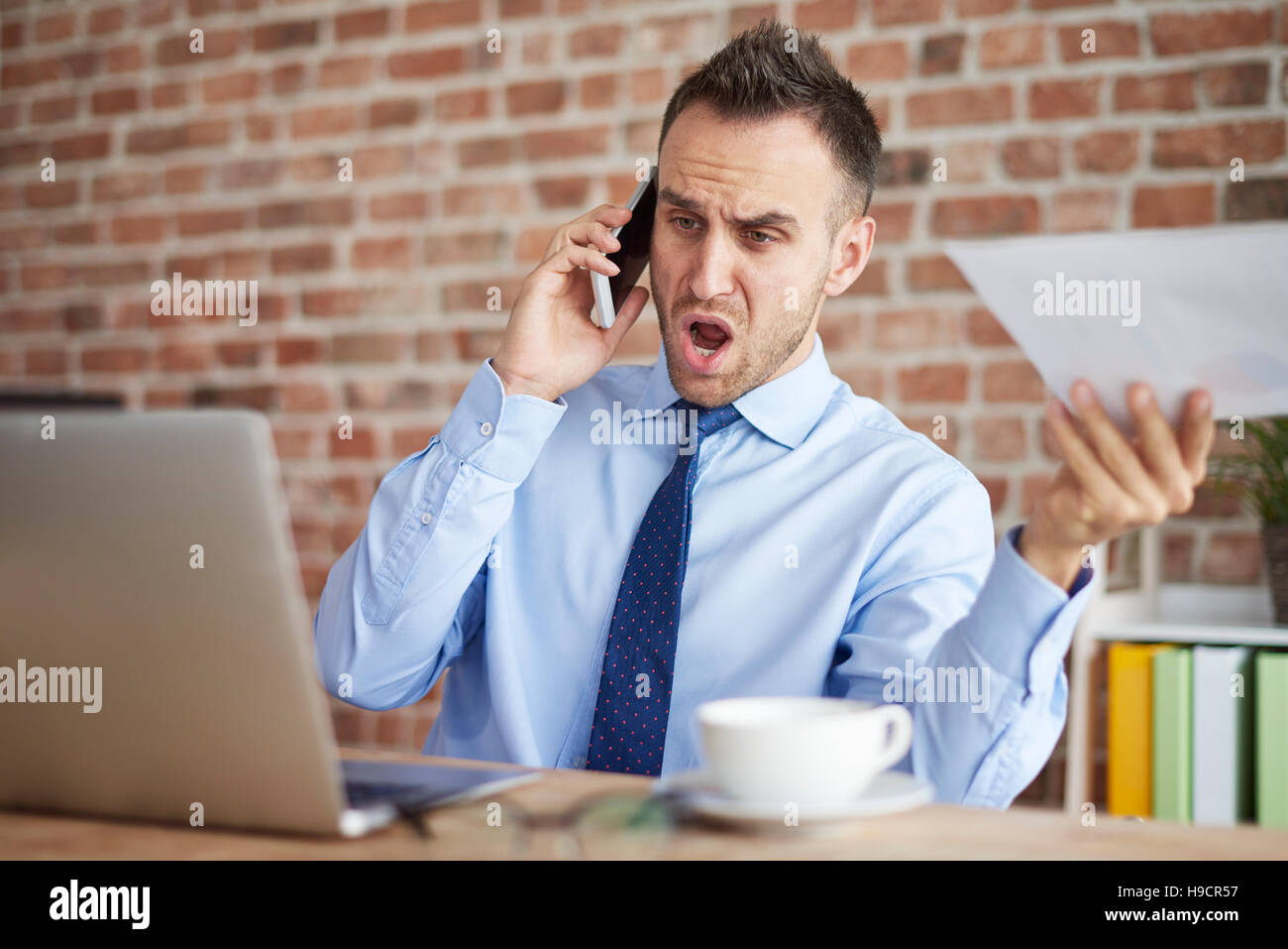 Angry man calling on phone hi-res stock photography and images - Alamy