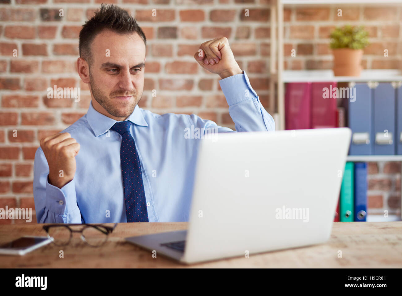 Finally he menaged to achieve success Stock Photo - Alamy