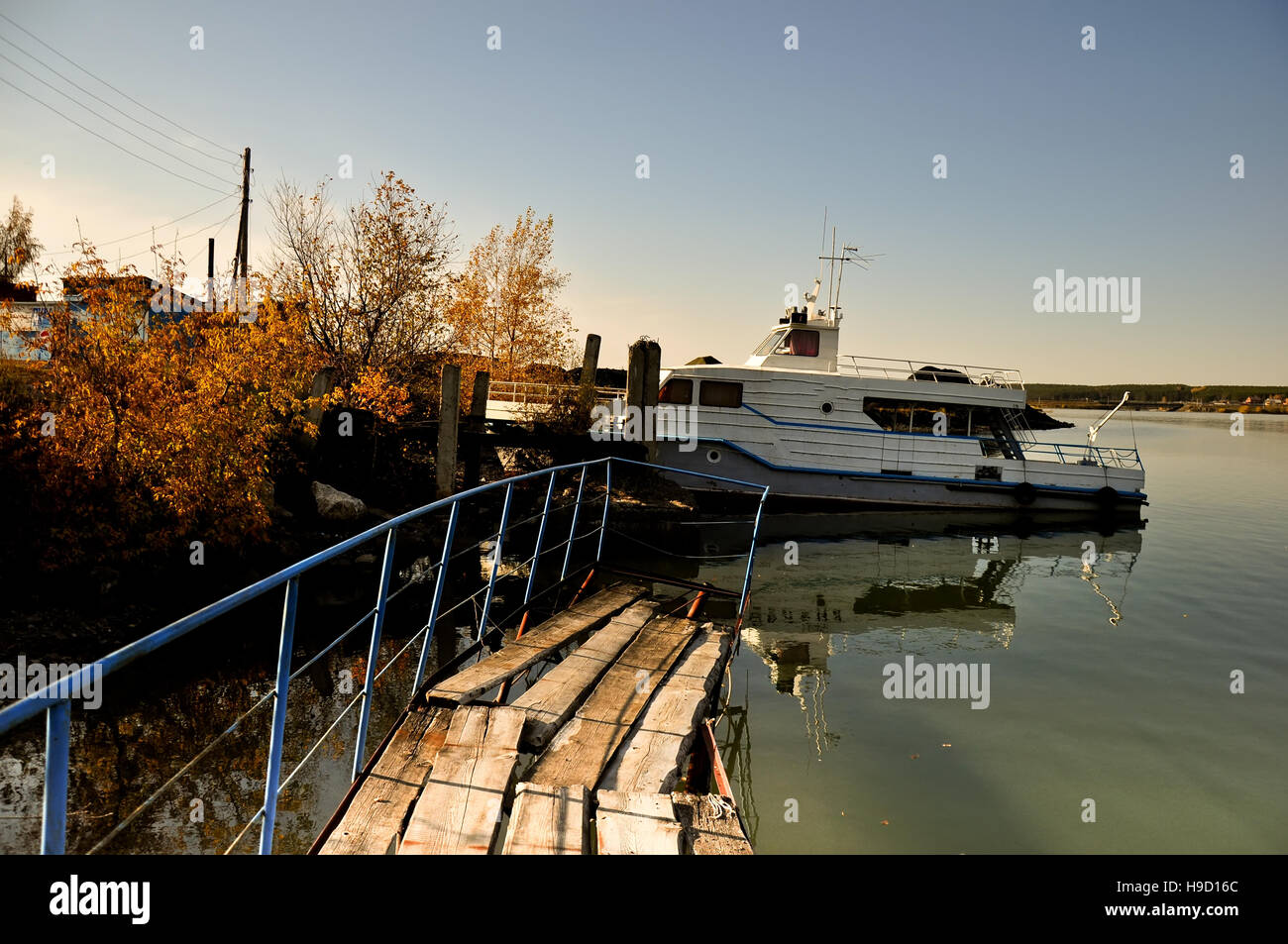 Wooden pier with boat hi-res stock photography and images - Alamy