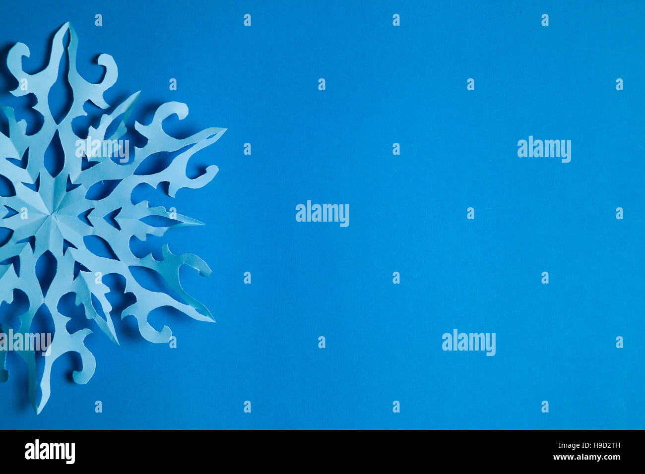 Blue Paper snowflake Stock Photo - Alamy