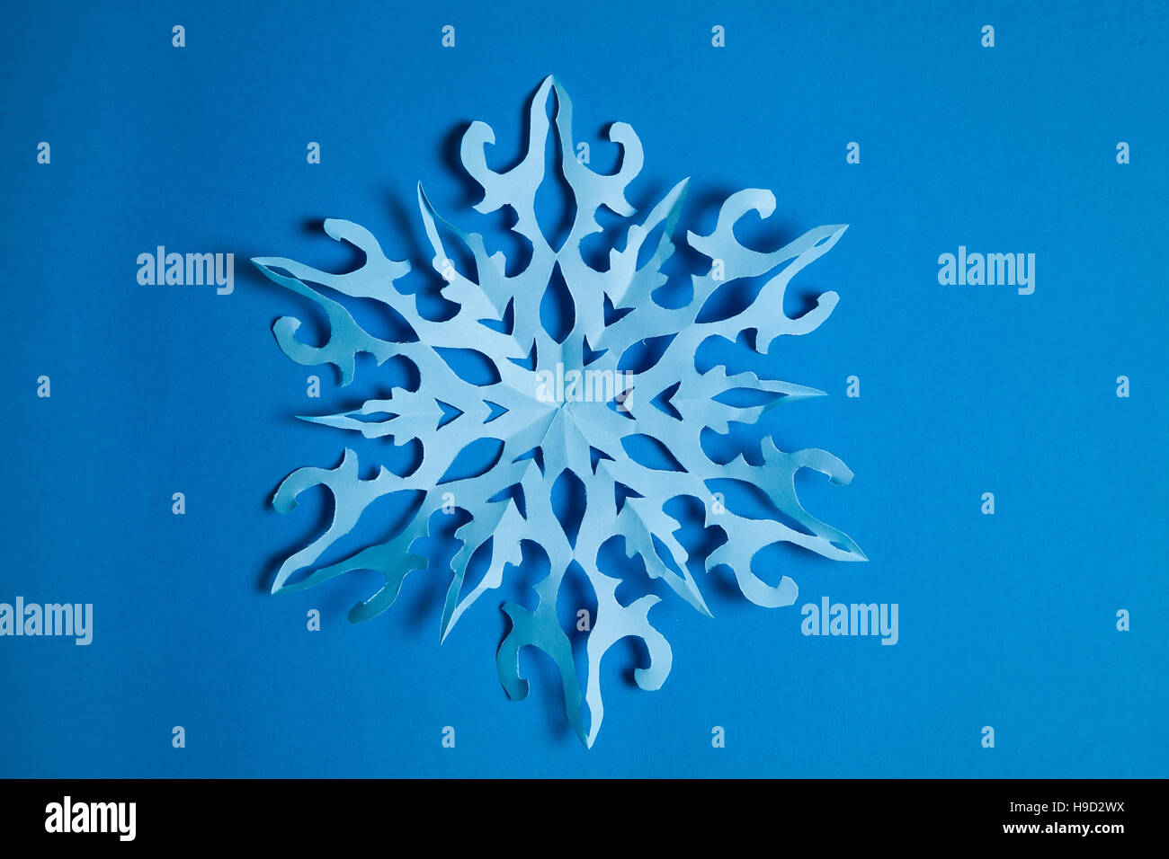 Blue Paper snowflake Stock Photo - Alamy