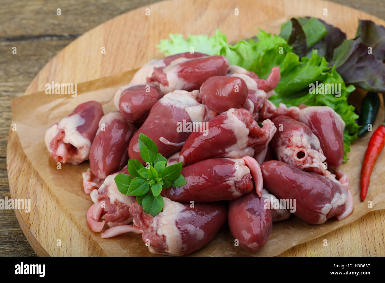 Raw chicken hearts on the plate ready for cooking Stock Photo - Alamy