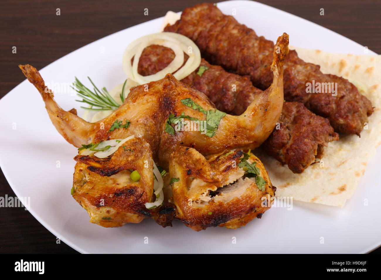 Beef kebab and grilled Quail with onion and parsley Stock Photo - Alamy