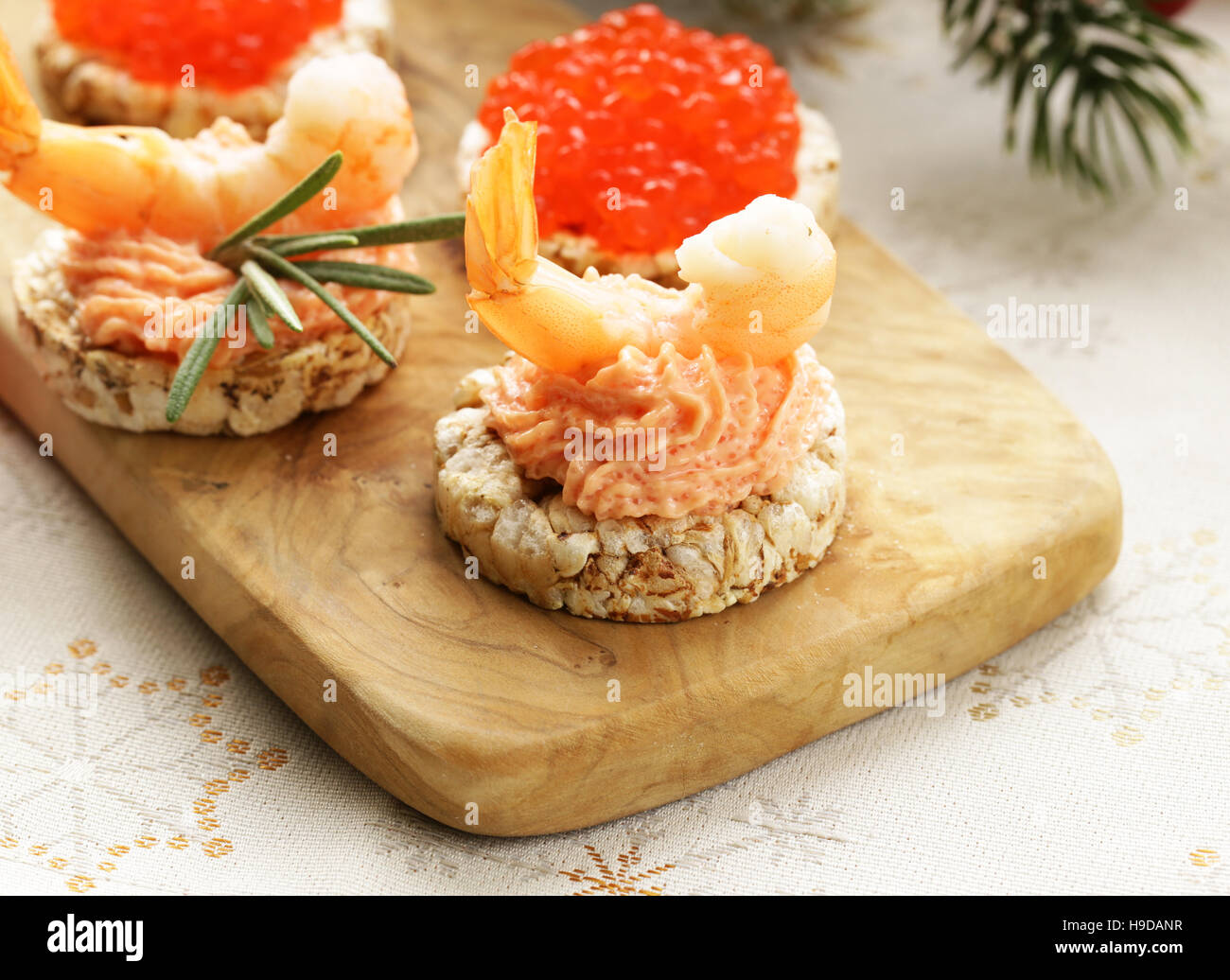 Christmas appetizers. Small tartlets with caviar and pate. Buffet and ...