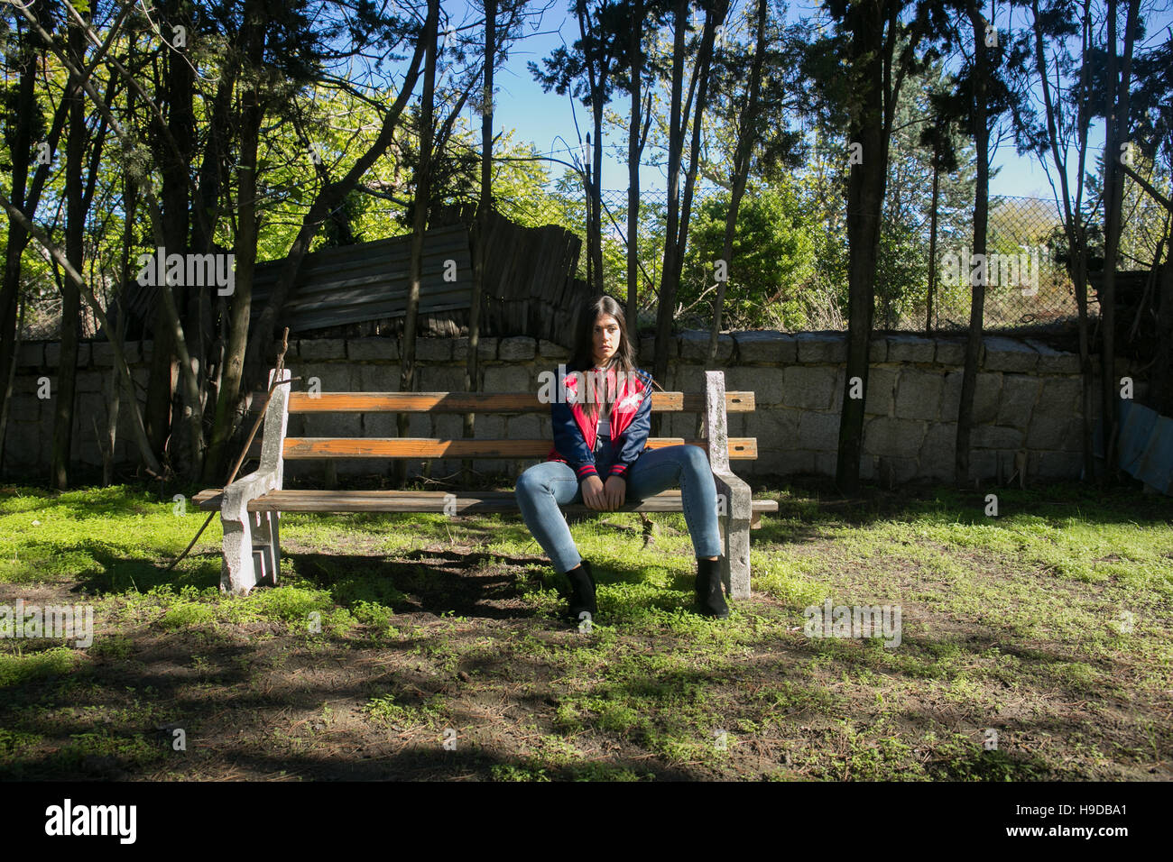 girl posing in a bench Stock Photo - Alamy