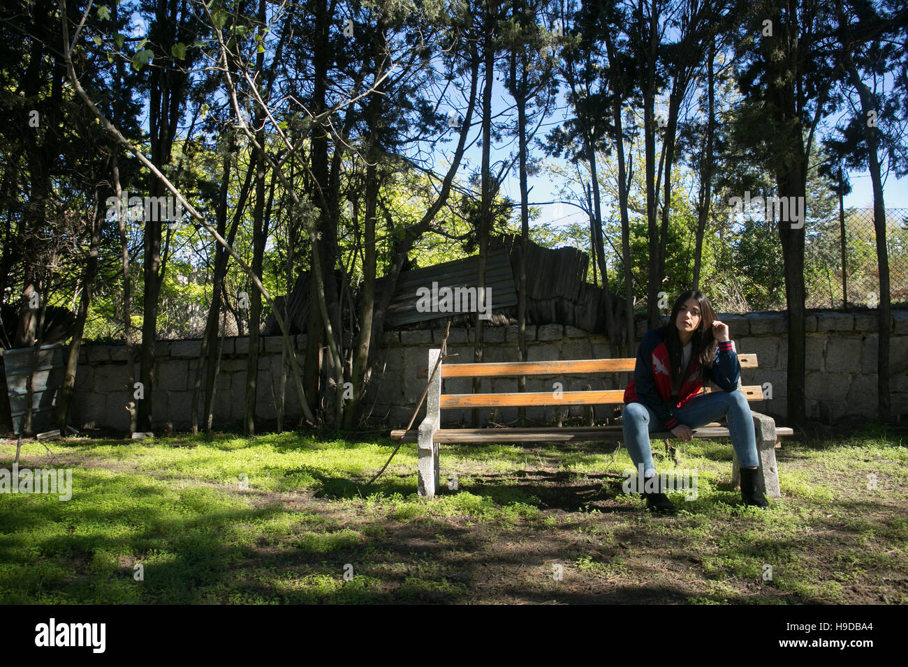 girl posing in a bench Stock Photo - Alamy