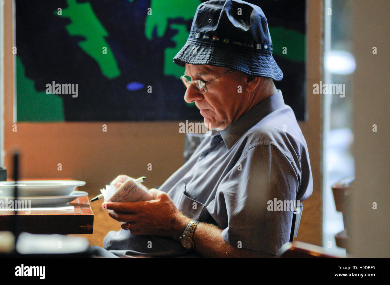 Elderly man alone in a restaurant Stock Photo - Alamy