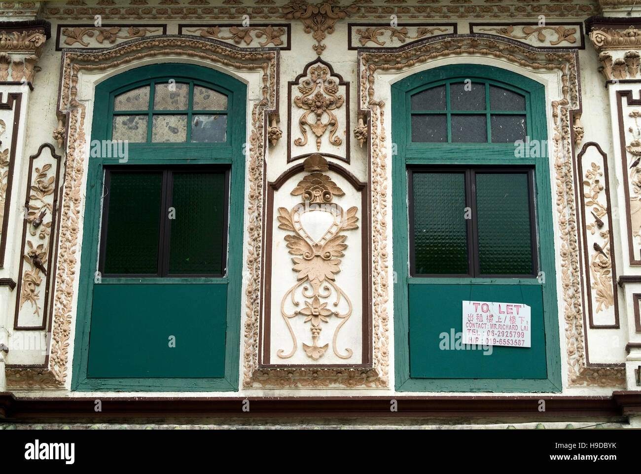 Decorations bordering the window of a Chinese terrace house in Malacca ...