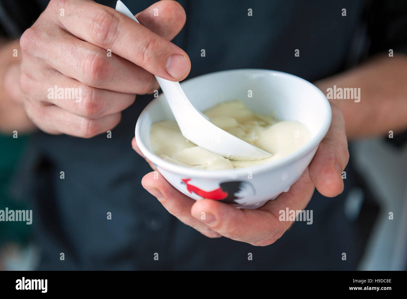 A man eating a dessert of fresh silken tofu in syrup from Funny ...