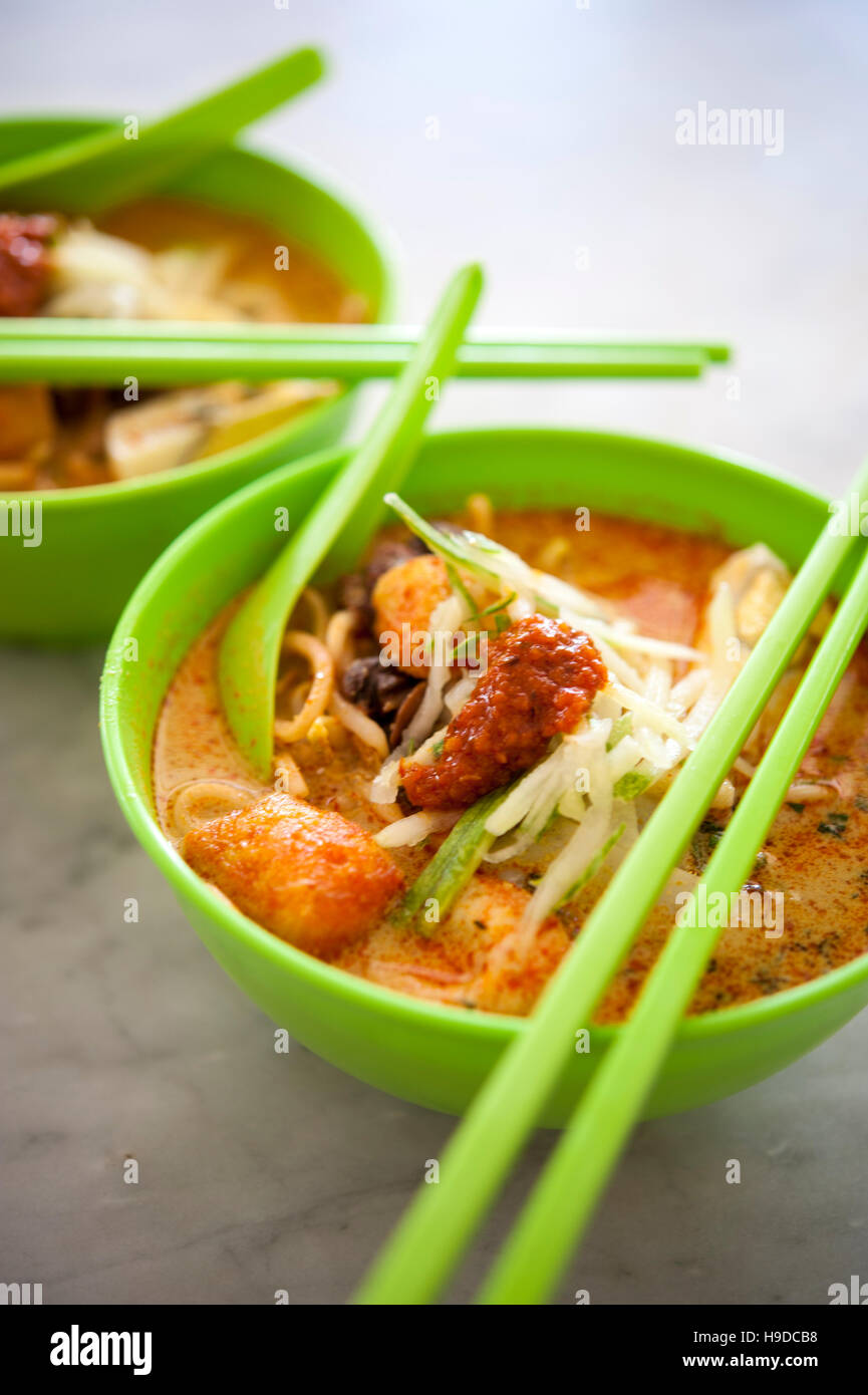 A bowl of laksa, a spicy noodle soup, a fusion of Chinese and Malay ...