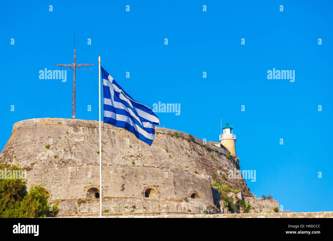 Old Fortress and waving greek flag in Kerkyra, Corfu island, Greece ...