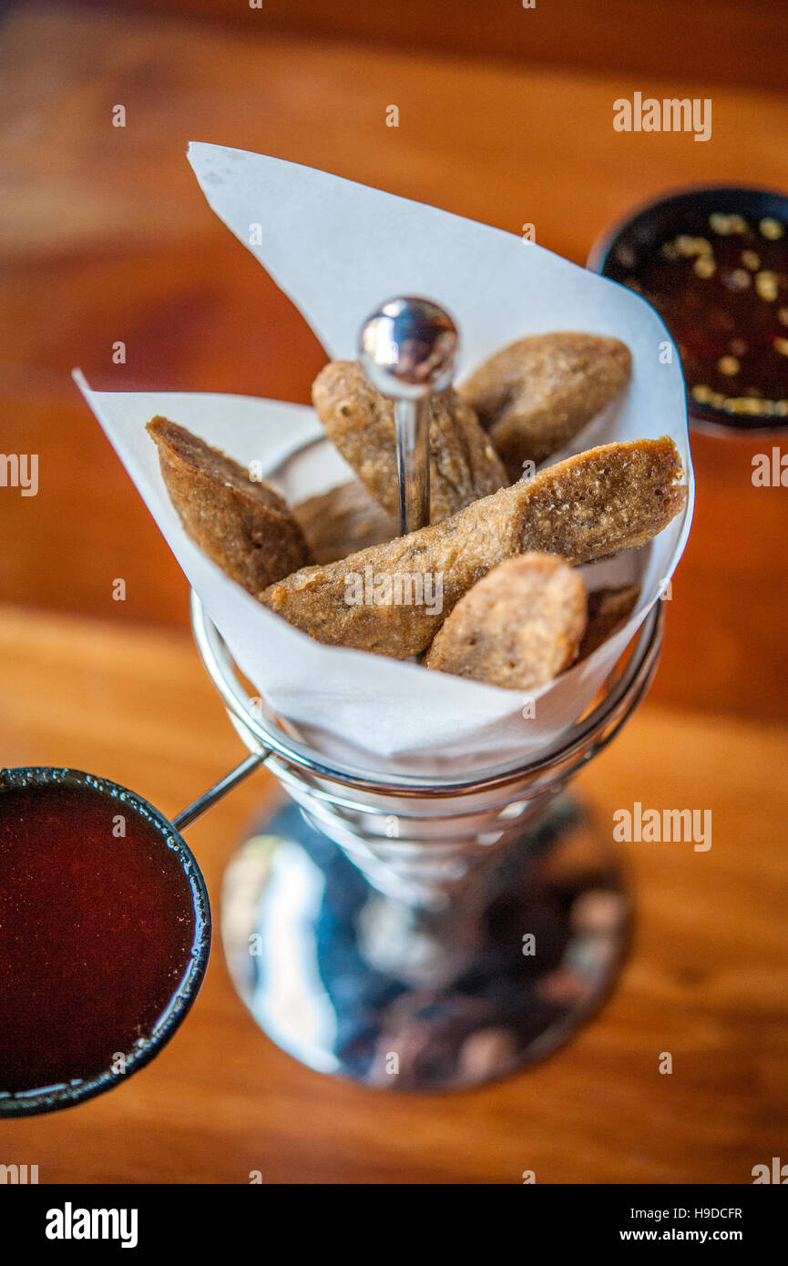 Keropok lekor, deep fried fish sausages eaten with chilli sauce, at the ...