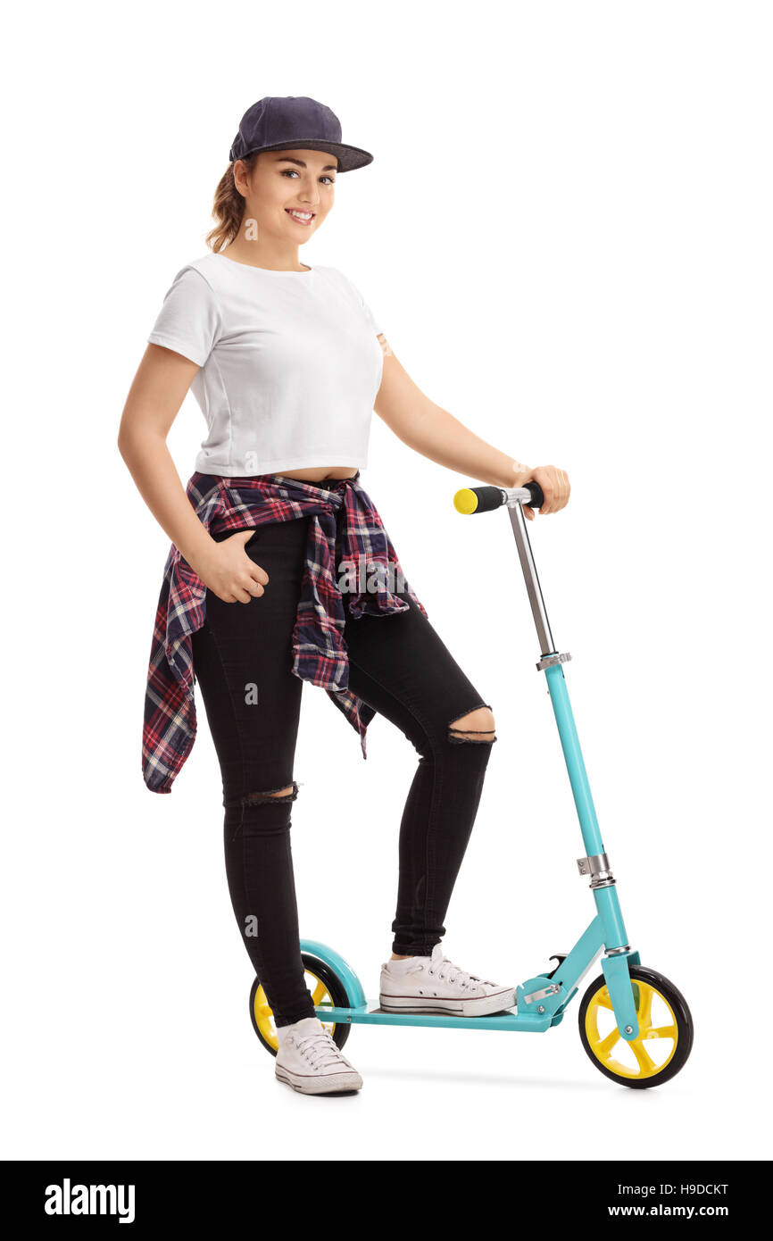 Full length portrait of a young woman with a scooter isolated on white ...