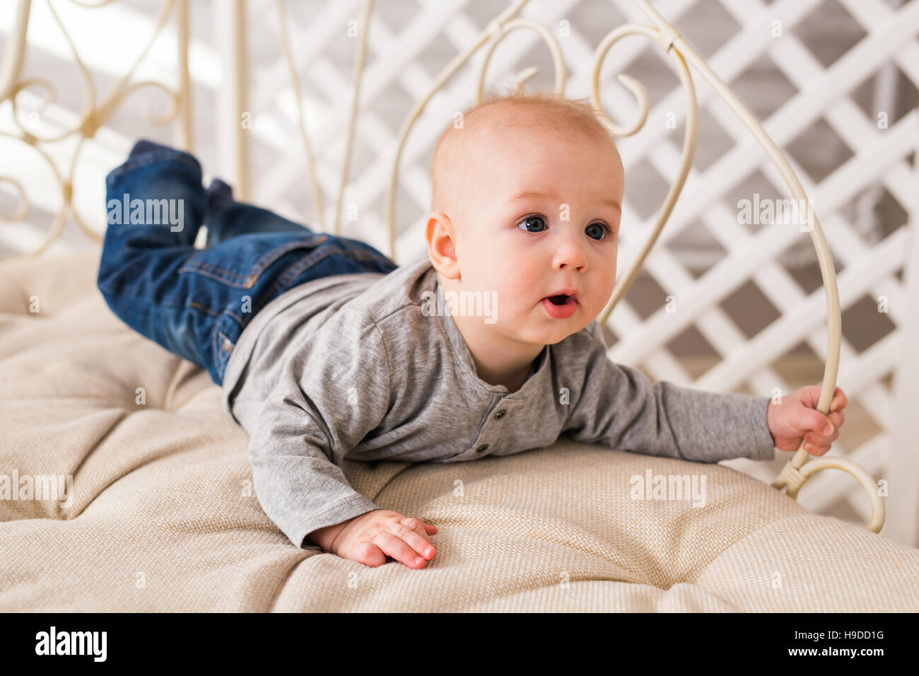 Little baby boy crawling on the floor at home Stock Photo - Alamy