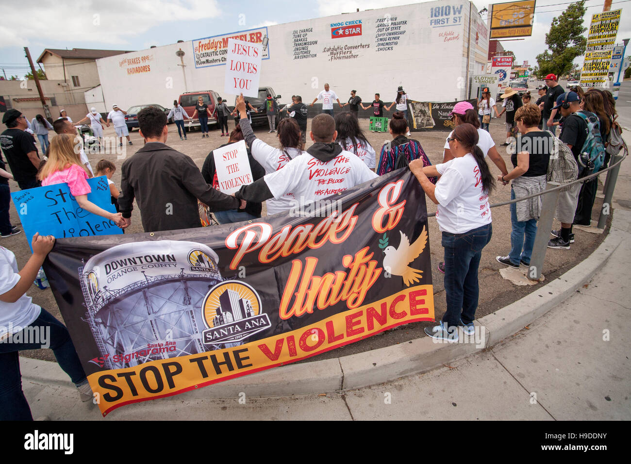 Local Hispanics join hands in a circle in Santa Ana, CA, at a rally ...