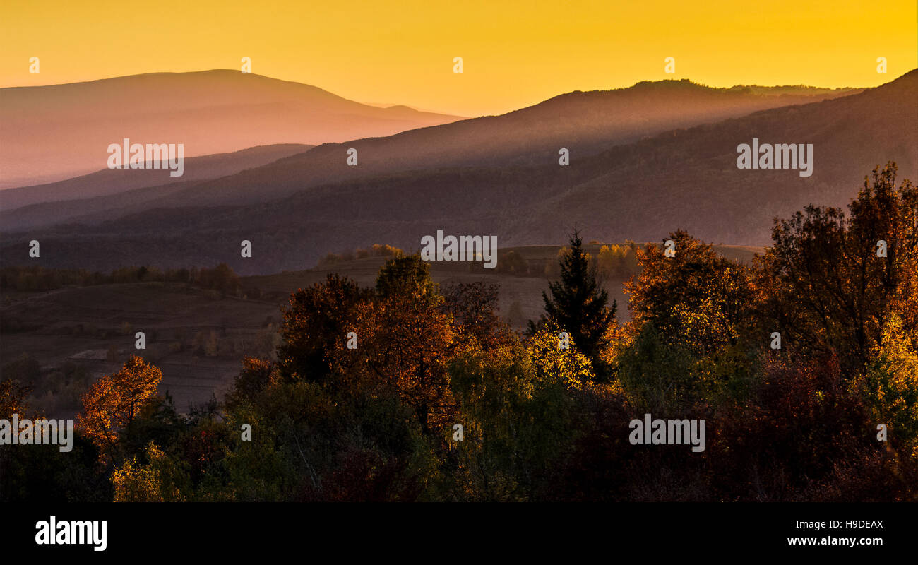 cold morning fog with red hot sunrise in the mountains Stock Photo - Alamy