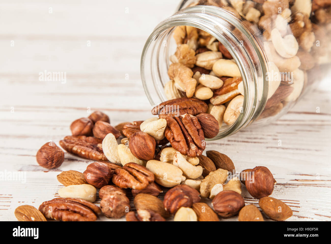 Mix of different nuts closeup photo Stock Photo - Alamy