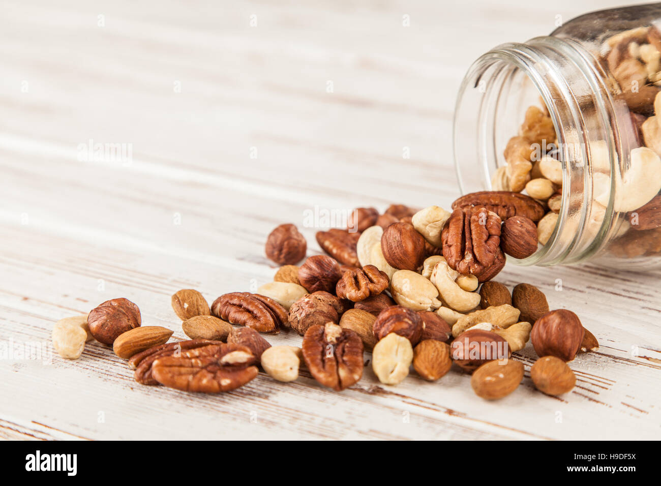 Mix of different nuts closeup photo Stock Photo - Alamy