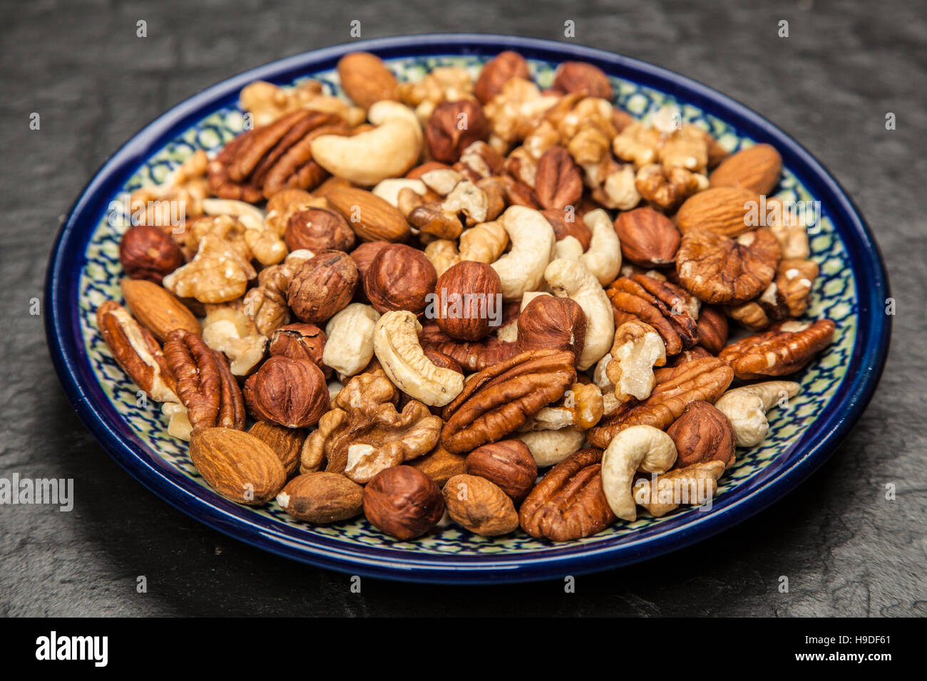 Mix of different nuts closeup photo Stock Photo - Alamy