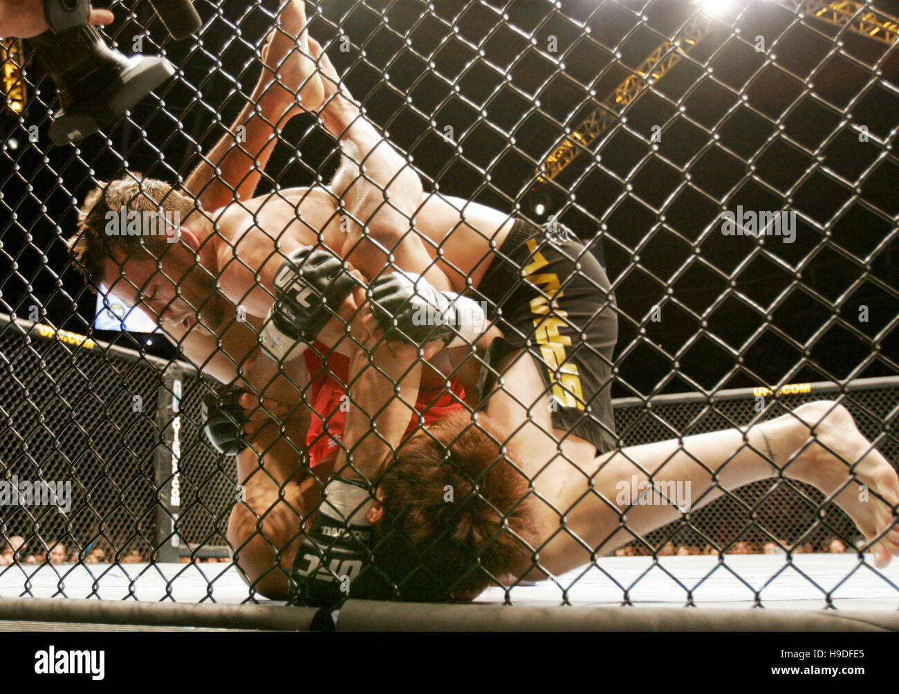 Jon Fitch, top, fights, Kuniyoshi Hironaka of Japan at the Ultimate ...