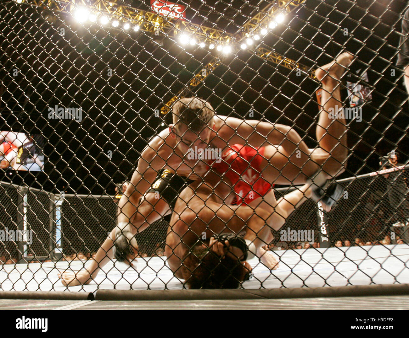 Jon Fitch, top, fights, Kuniyoshi Hironaka of Japan at the Ultimate ...