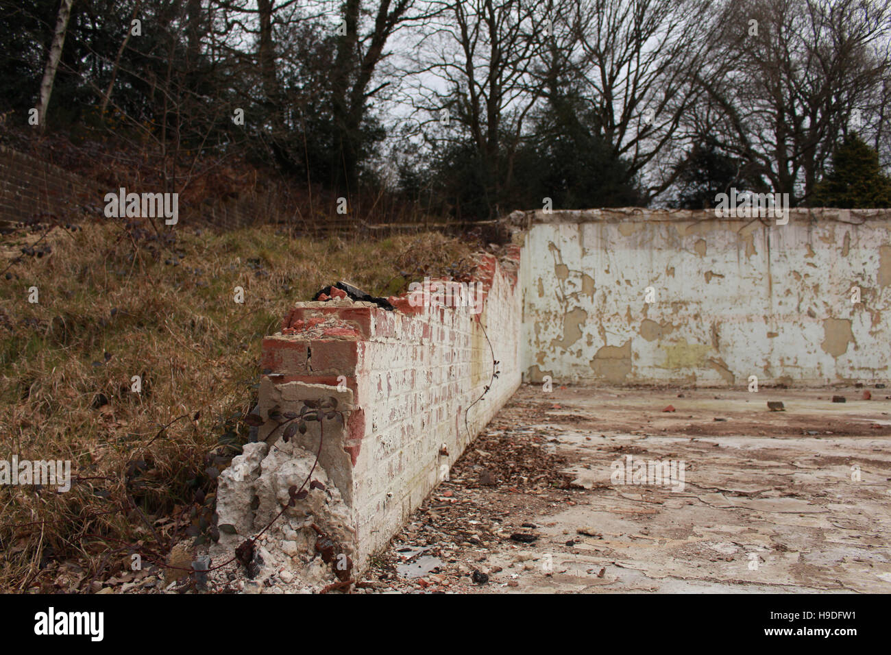 Moody brick wall crumbling away at a demolition site in Crowborough ...