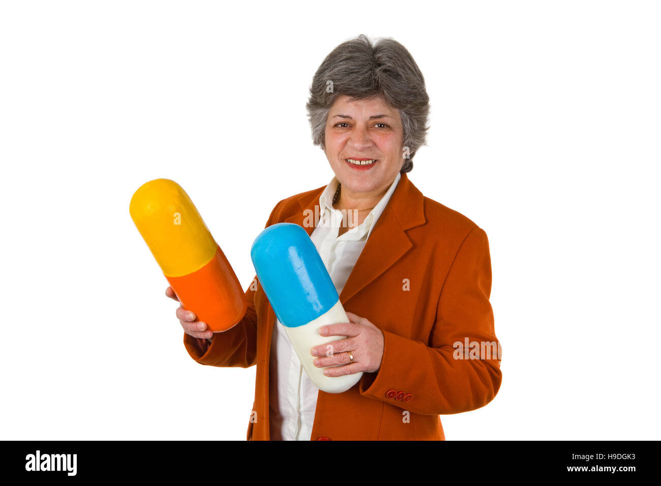Female senior with two big size pills - isolated on white background ...