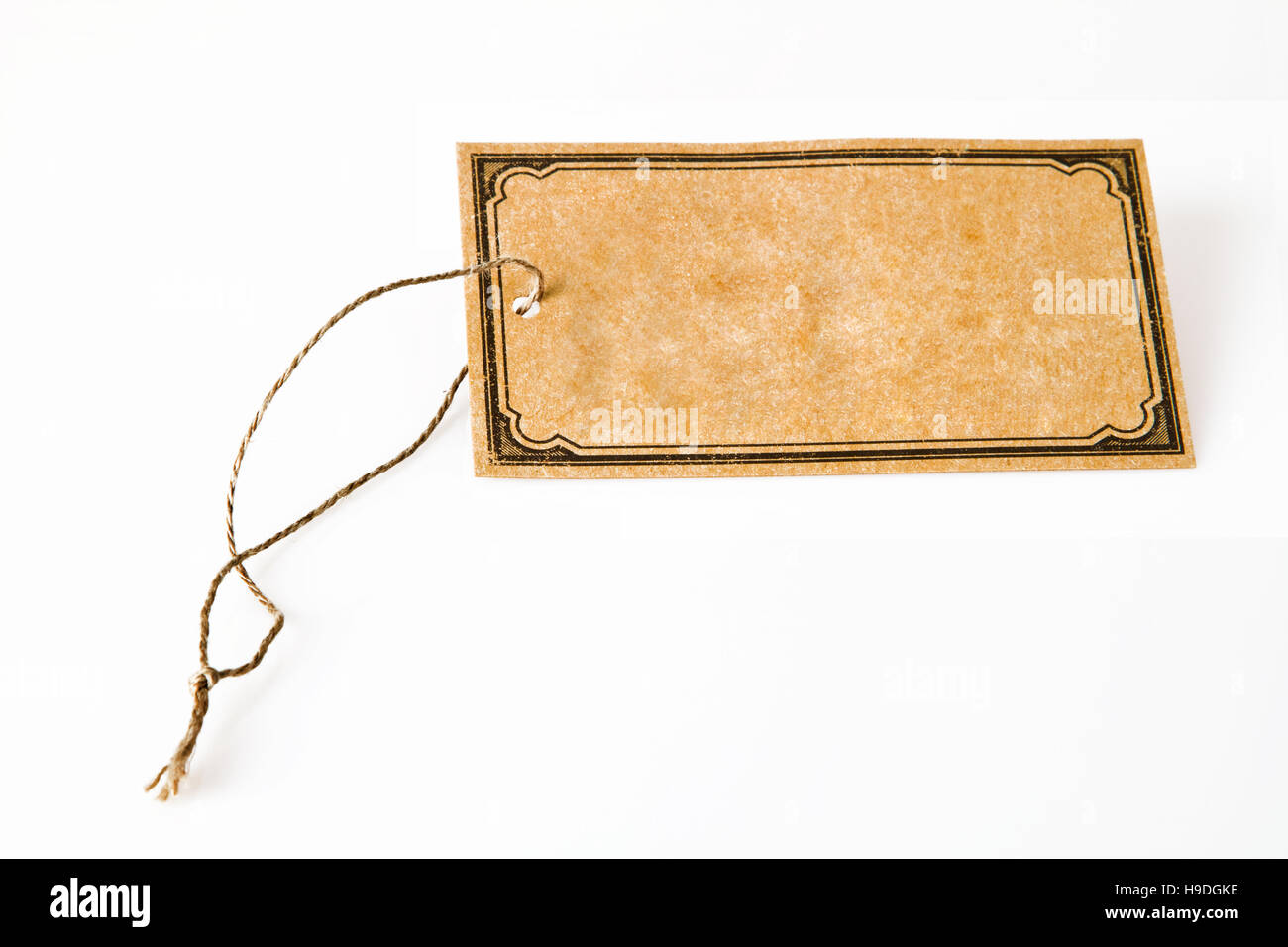 Blank label hanging on a rope, made of old and stained paper Stock ...