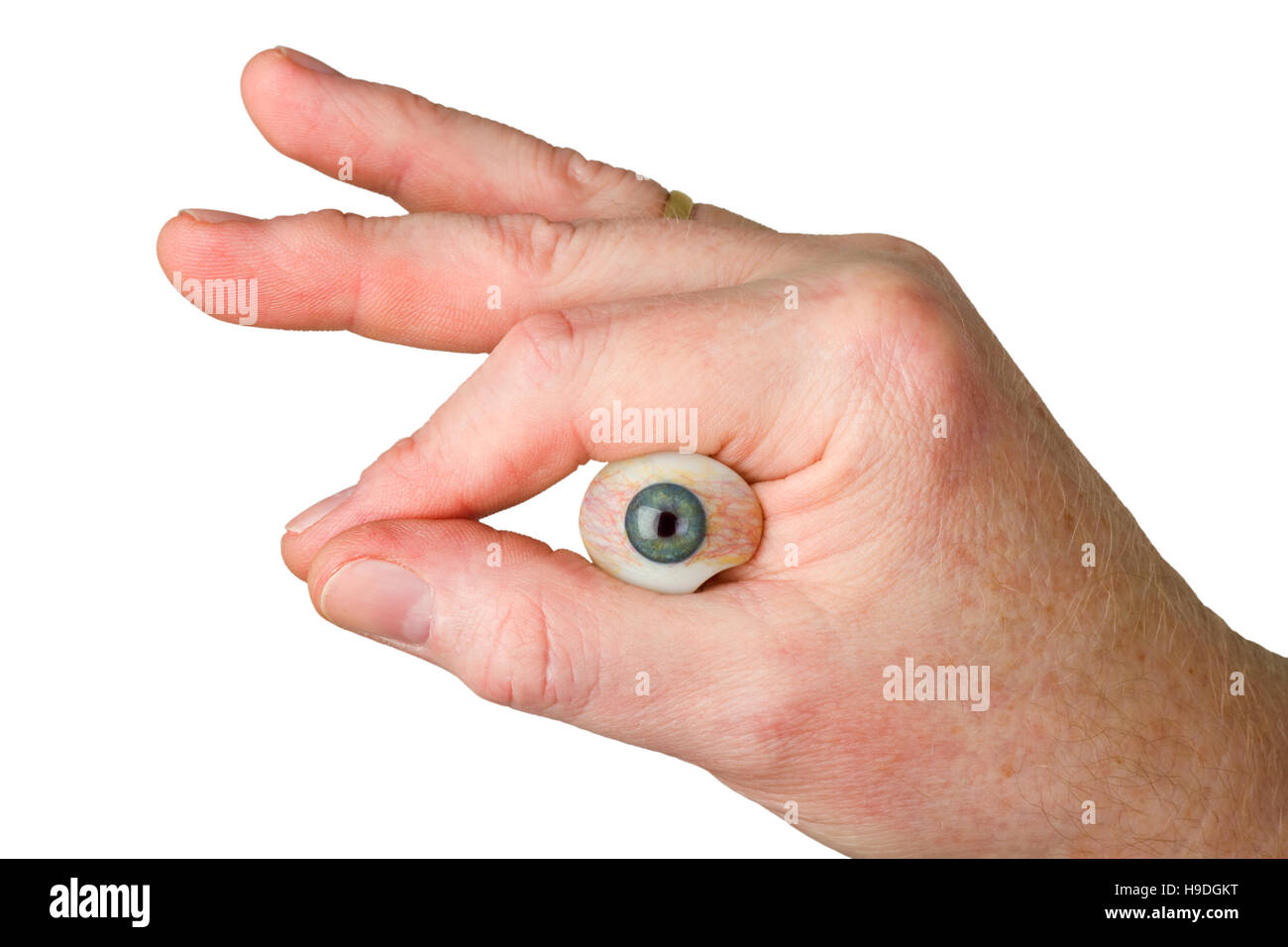 Hand holding glass eye - isolated on white background Stock Photo - Alamy