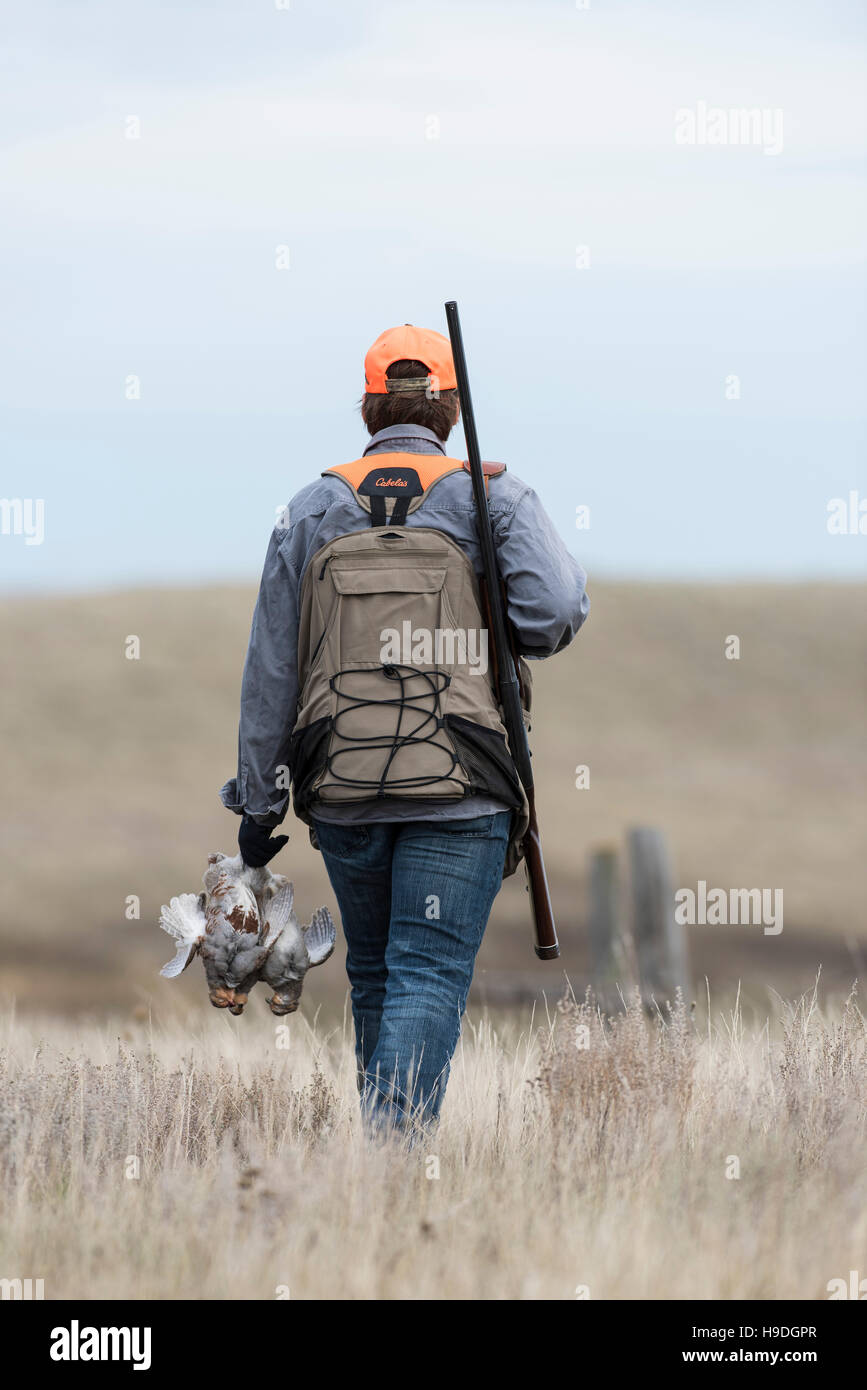 A hunter with Hungarian Partridge Stock Photo - Alamy