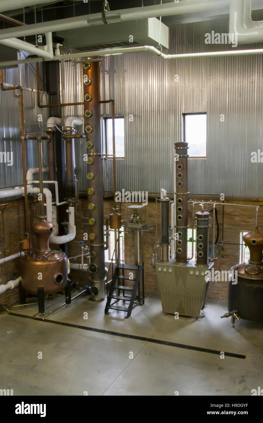 Copper still inside craft bourbon distillery Stock Photo - Alamy