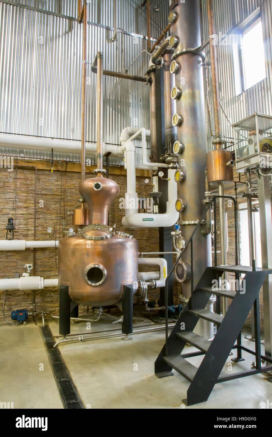 Copper still inside craft bourbon distillery Stock Photo - Alamy