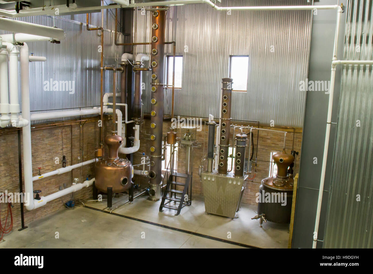 Copper still inside craft bourbon distillery Stock Photo - Alamy
