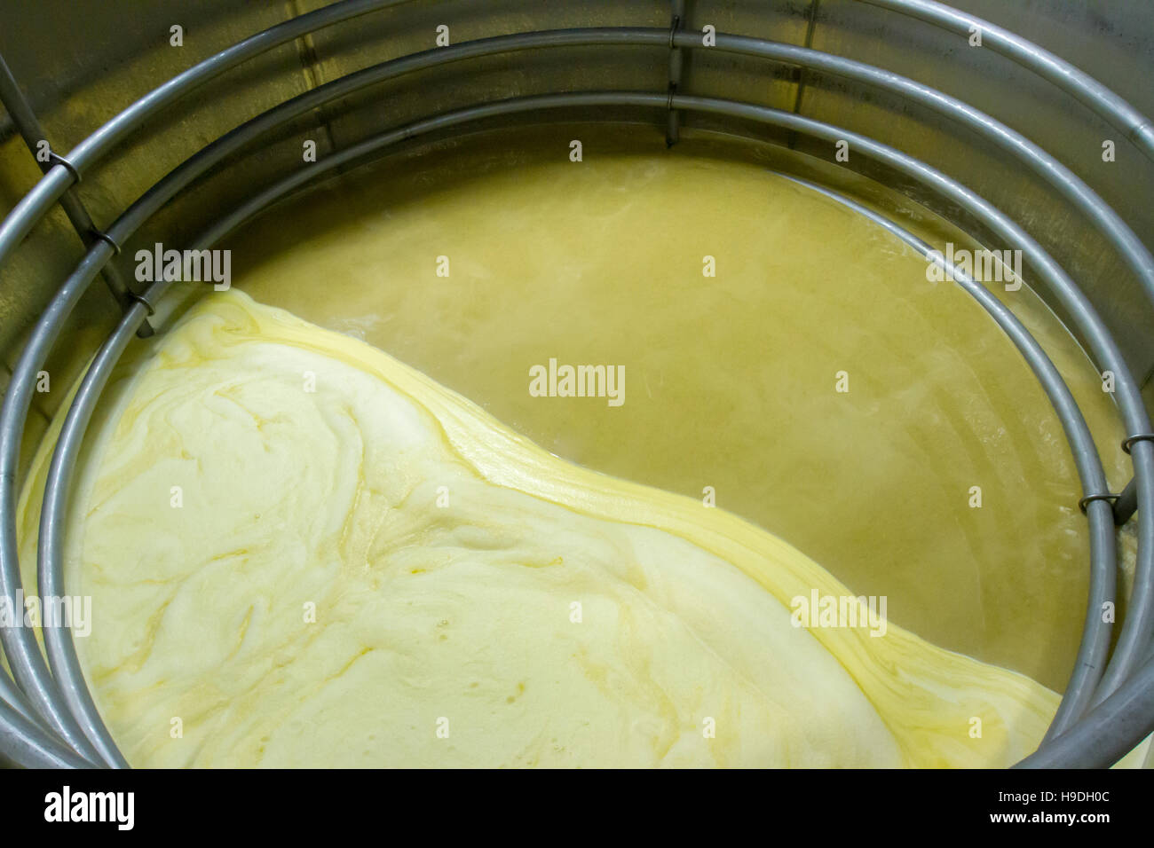Inside aluminum fermentation vat with corn mash and water in craft ...