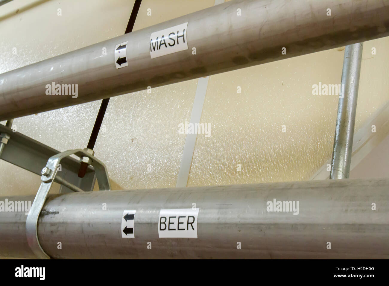 Inside modern fermentation room with pipes for mash and beer in bourbon ...