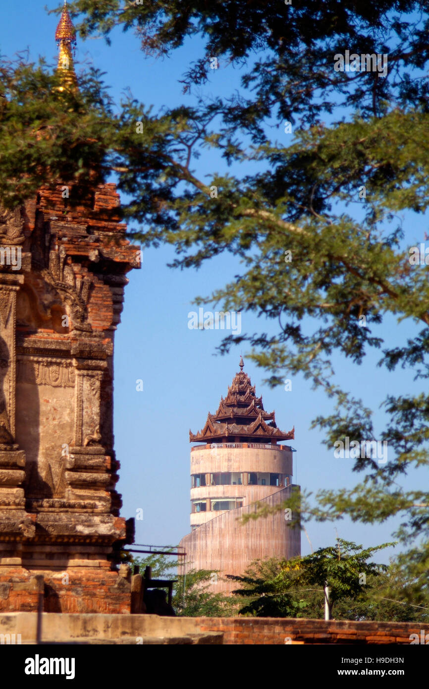 An antique temple and the modern Nan Myint watch tower in Bagan in ...
