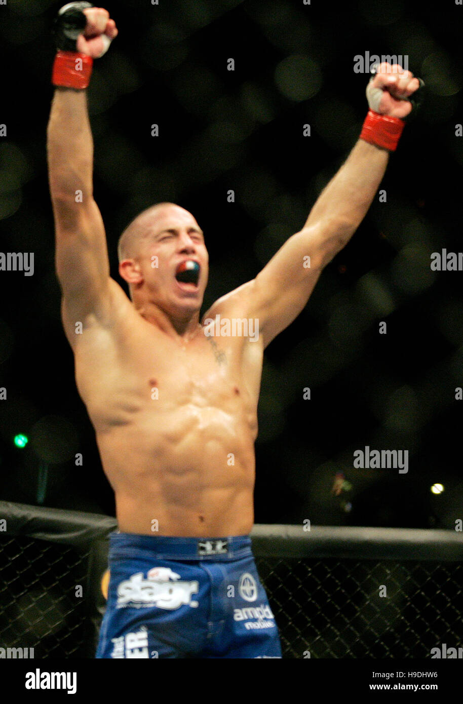 Georges St. Pierre celebrates his victory over Matt Hughes during ...