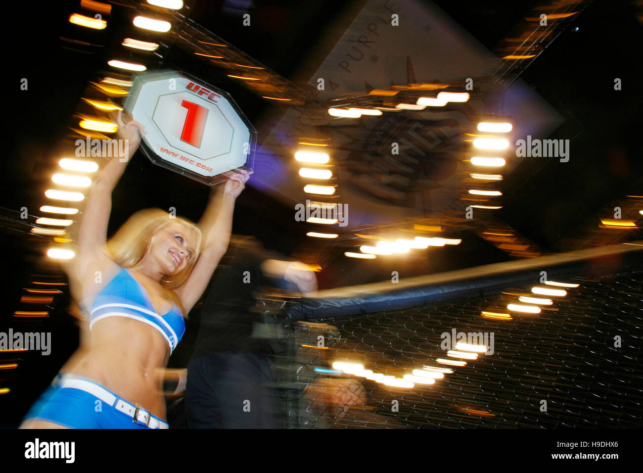 an-octagon-girl-holding-a-round-number-during-the-ultimate-fighting