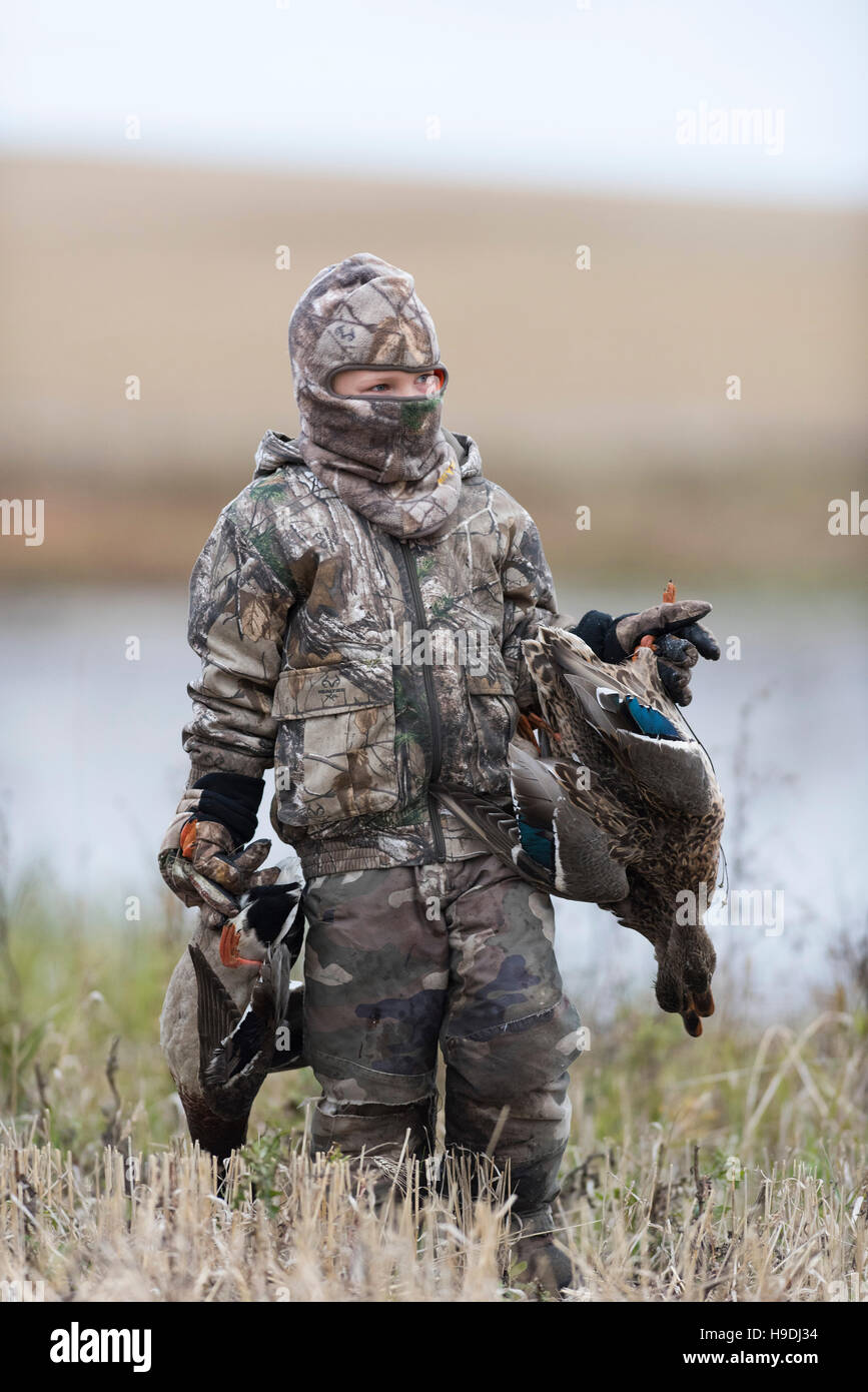 A Young duck hunter with Ducks in North Dakota Stock Photo - Alamy