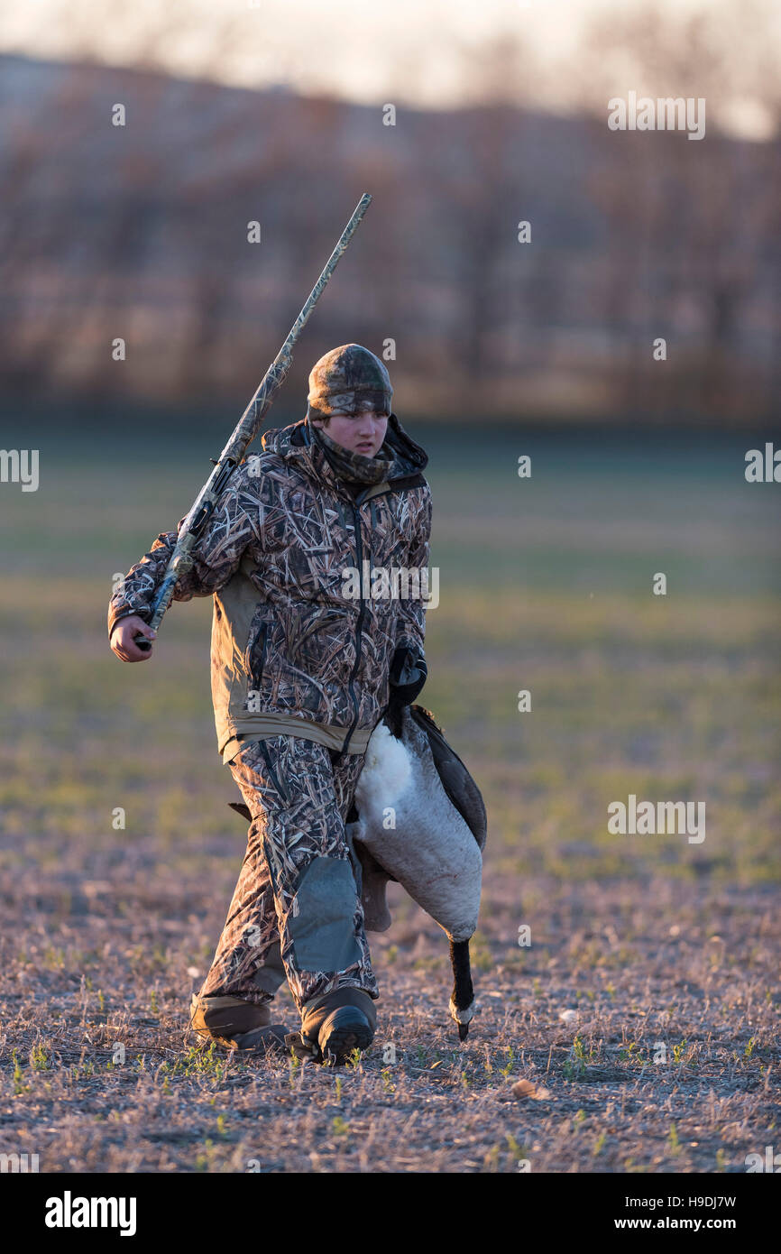 A young hunter with a Canada Goose Stock Photo - Alamy