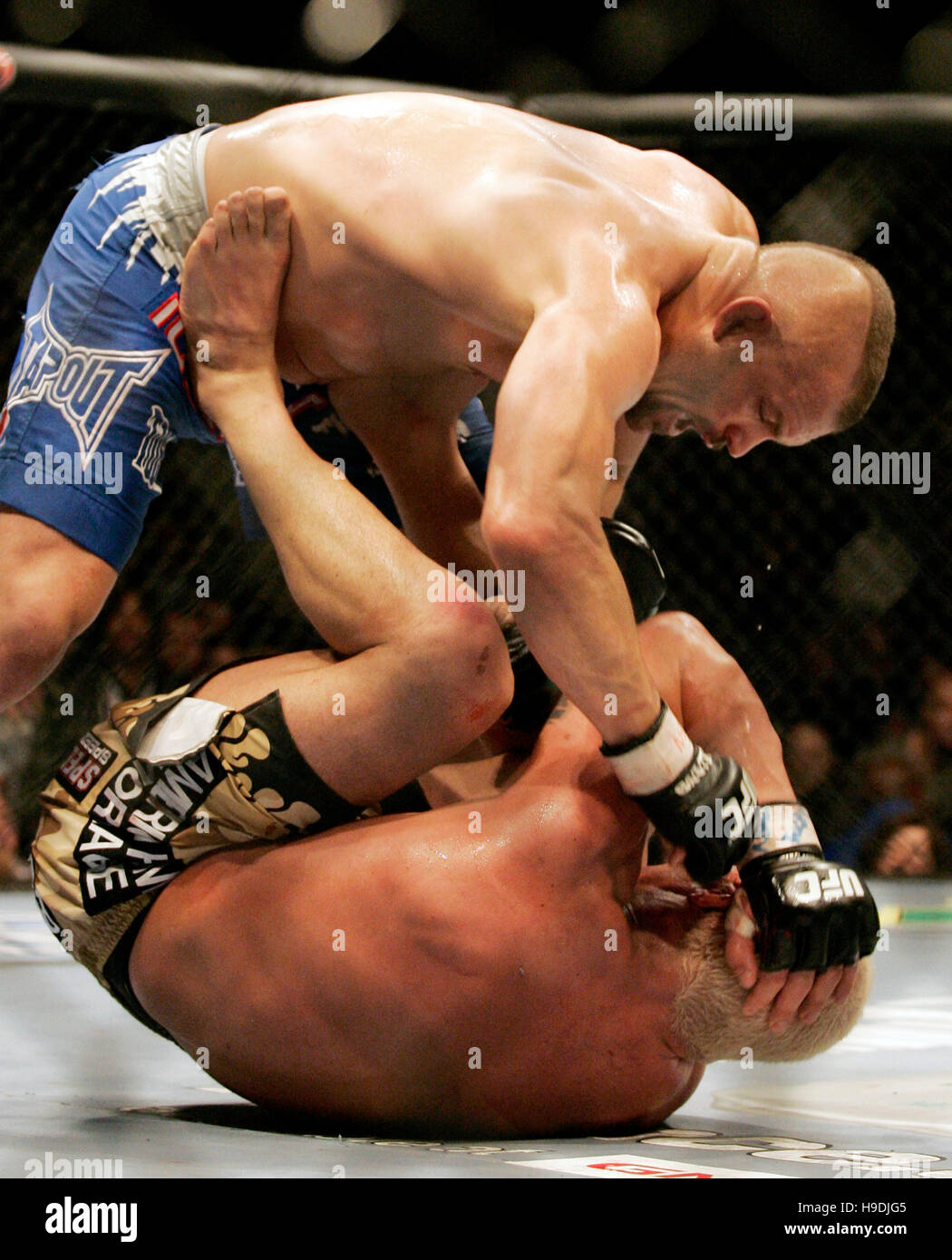 Chuck Liddell, top, punches Tito Ortiz at the Ultimate Fighting ...