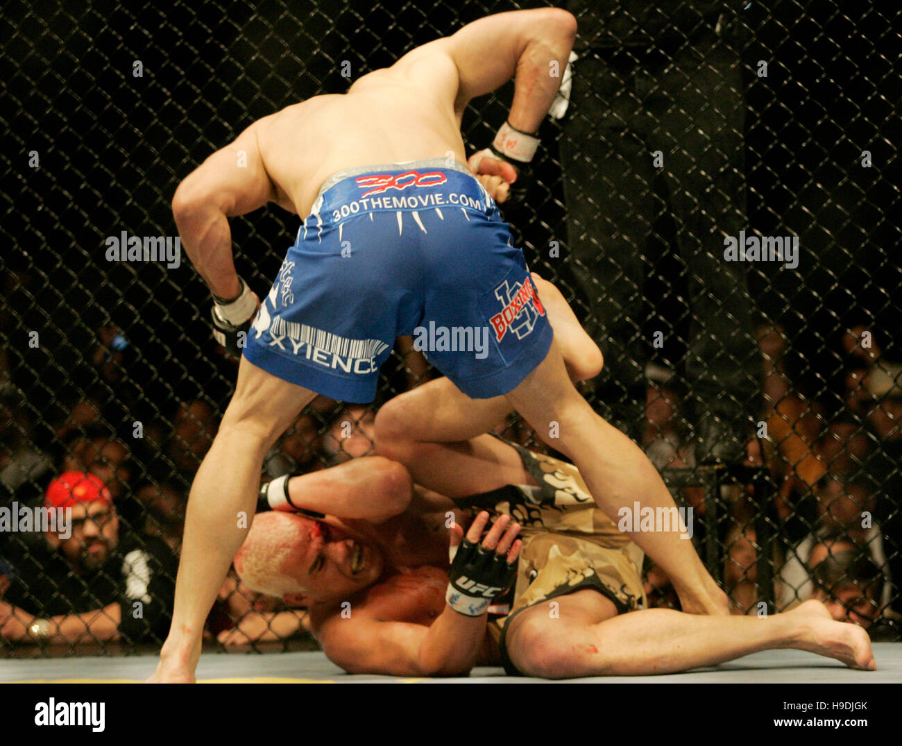 Chuck Liddell, top, punches Tito Ortiz at the Ultimate Fighting ...