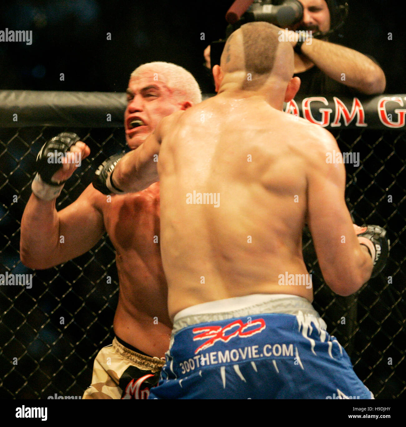 Chuck Liddell, right, punches Tito Ortiz at the Ultimate Fighting ...