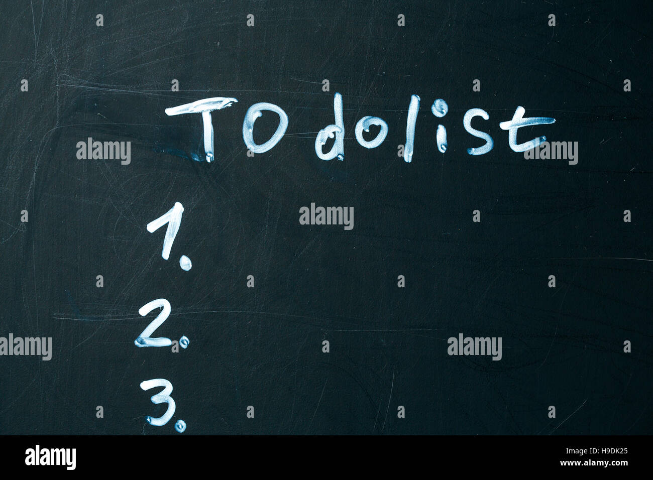 inscription do it list drawn with chalk on a school blackboard dark ...