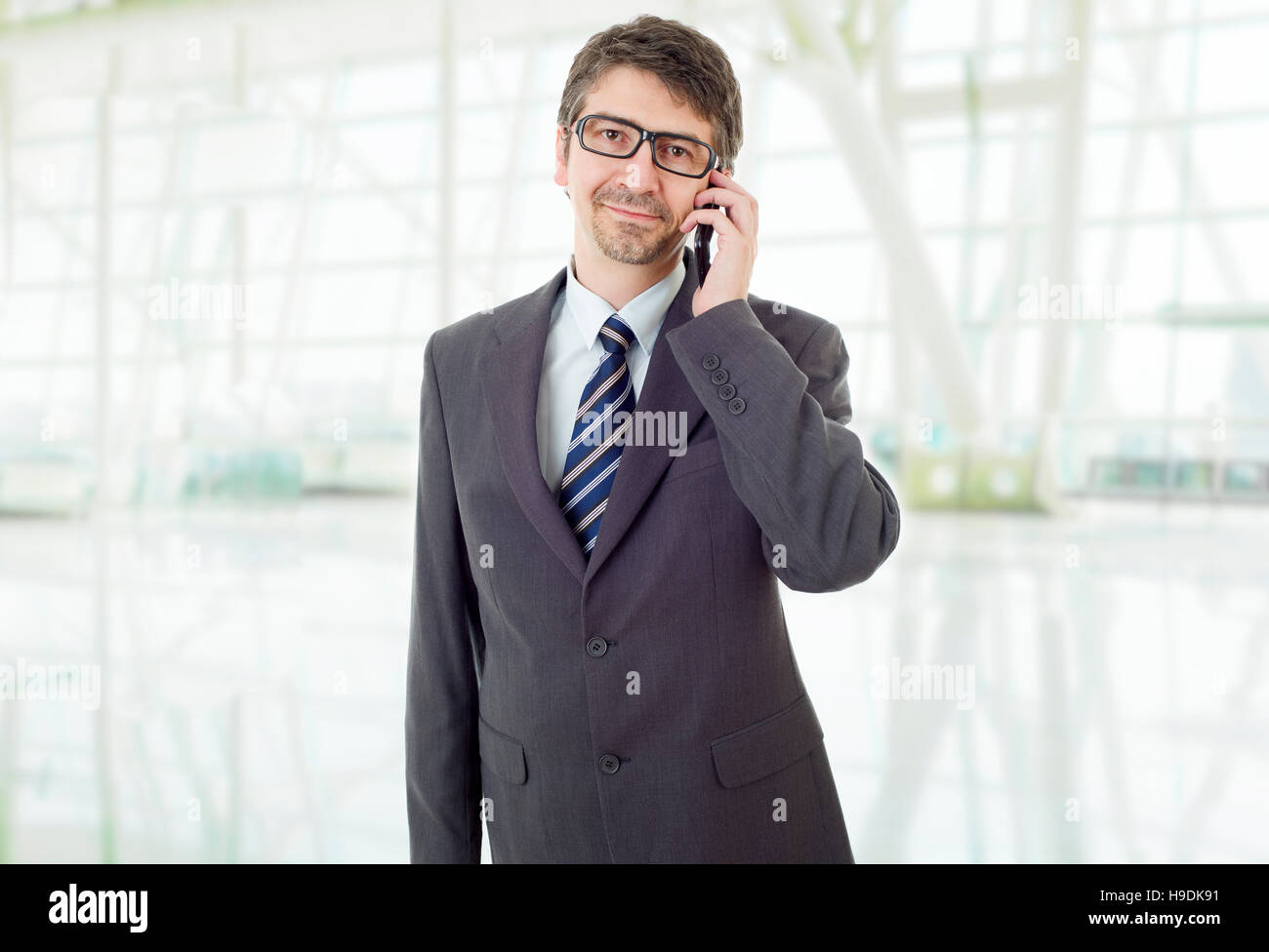 happy business man on the phone, at the office Stock Photo - Alamy