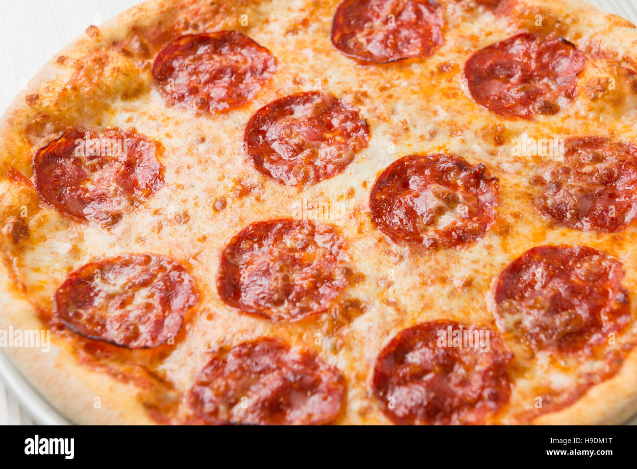 Detail of salami pizza Stock Photo - Alamy