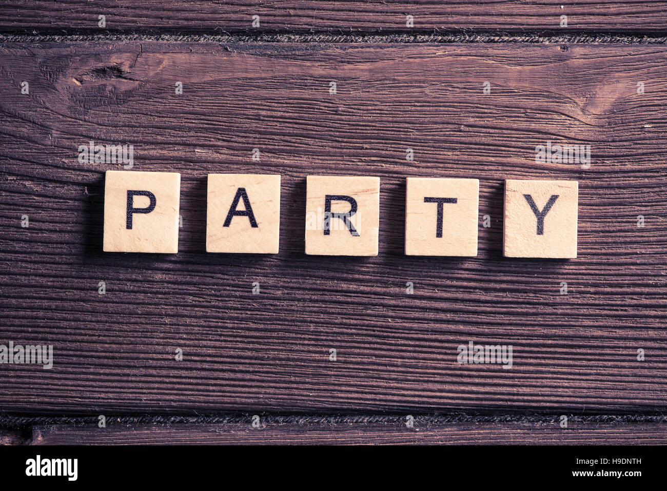 wooden elements with letter collected to word party Stock Photo - Alamy