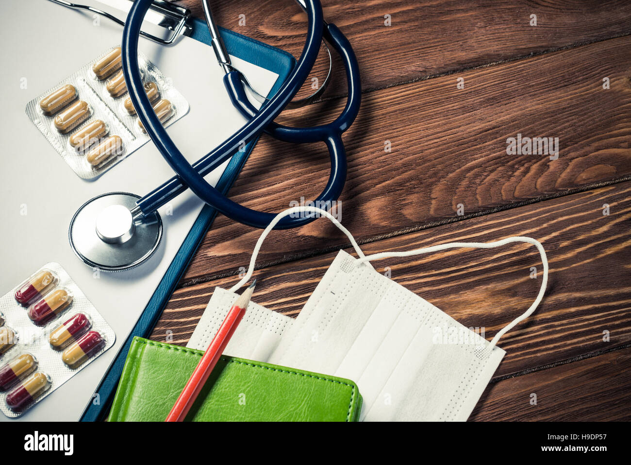 Desk of doctor with medicine things Stock Photo - Alamy