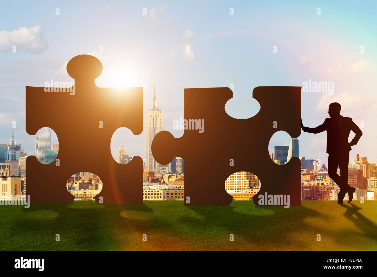 Business concept of teamwork with jigsaw puzzle Stock Photo - Alamy